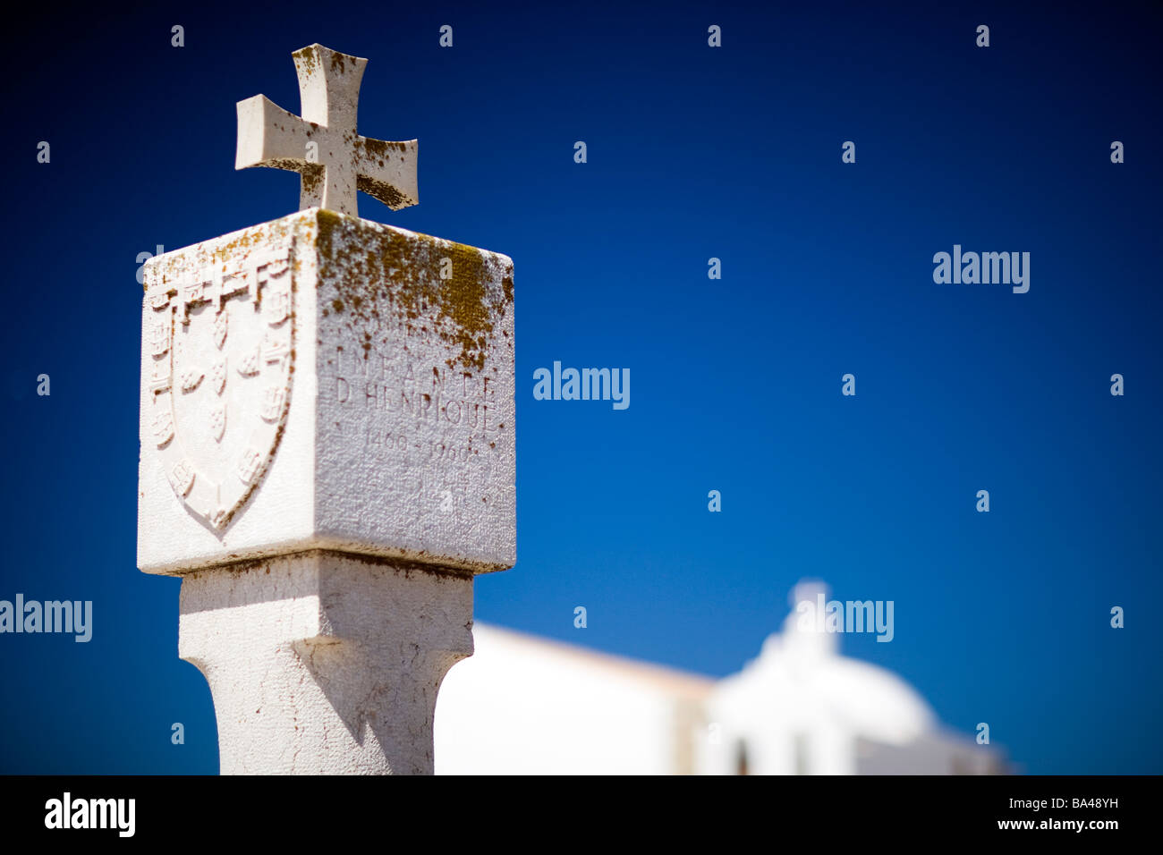 Stone cross with the Portuguese national emblem and Nossa Senhora da ...