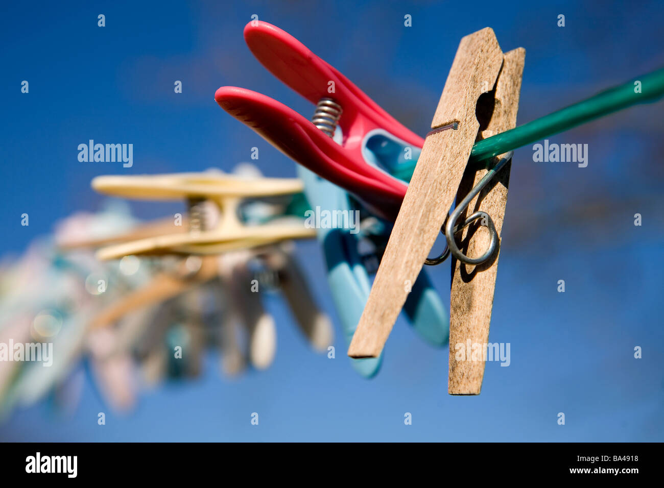 clothes pegs on washing line Stock Photo - Alamy