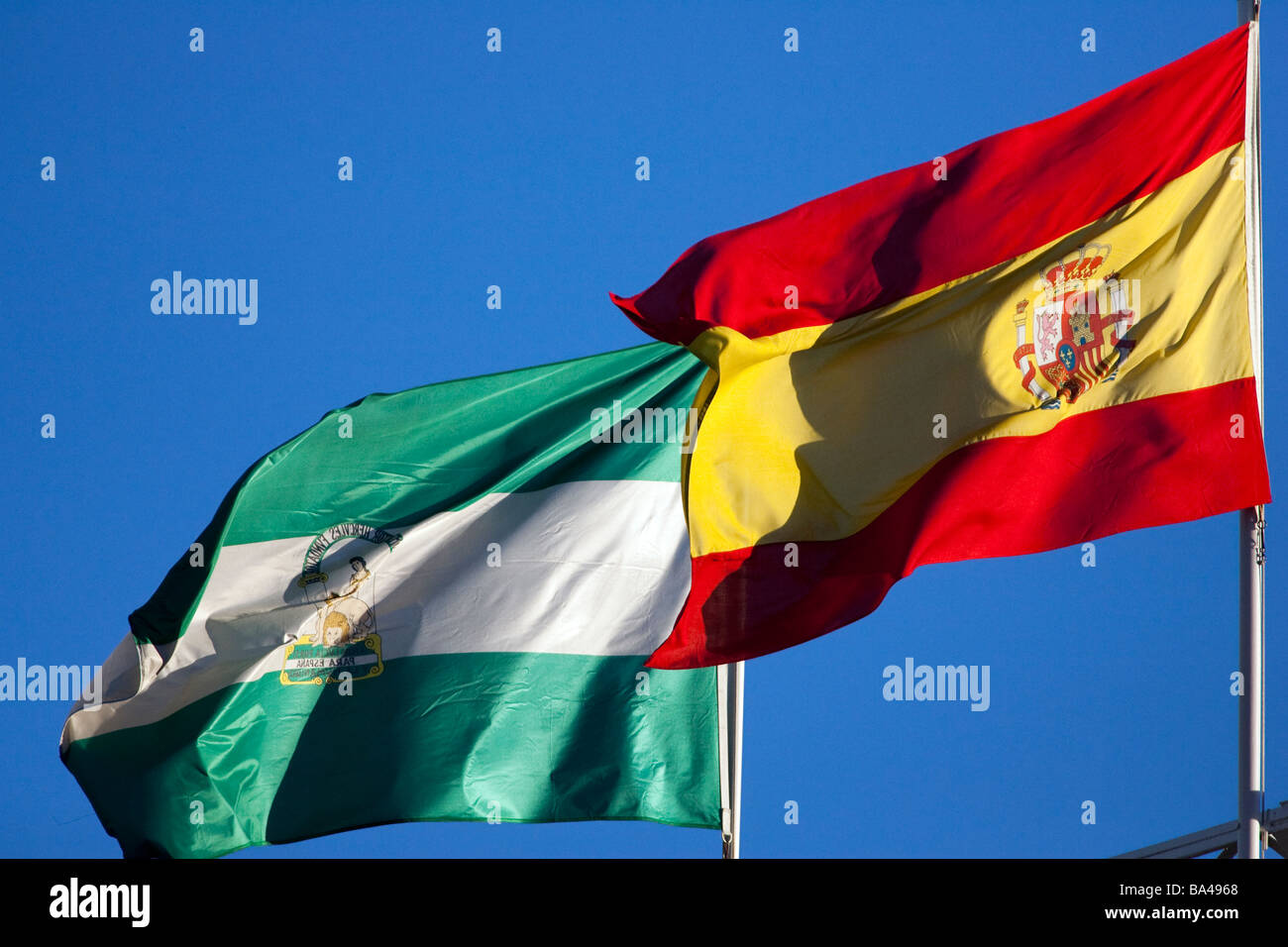 The flags of Spain right and the autonomous community of Andalusia ...