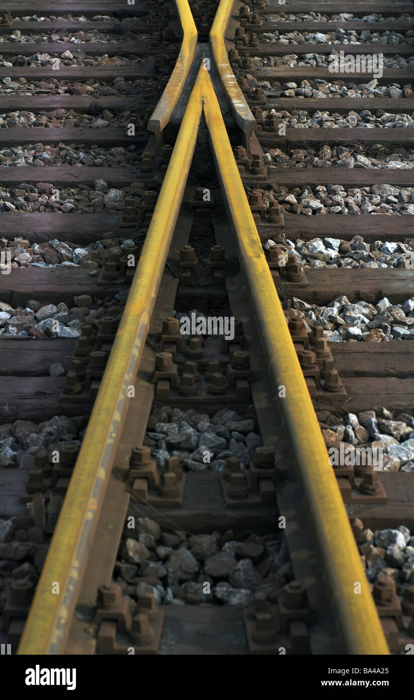 Tracks close-up detail fork rails points gravels thresholds rusty rusts ...