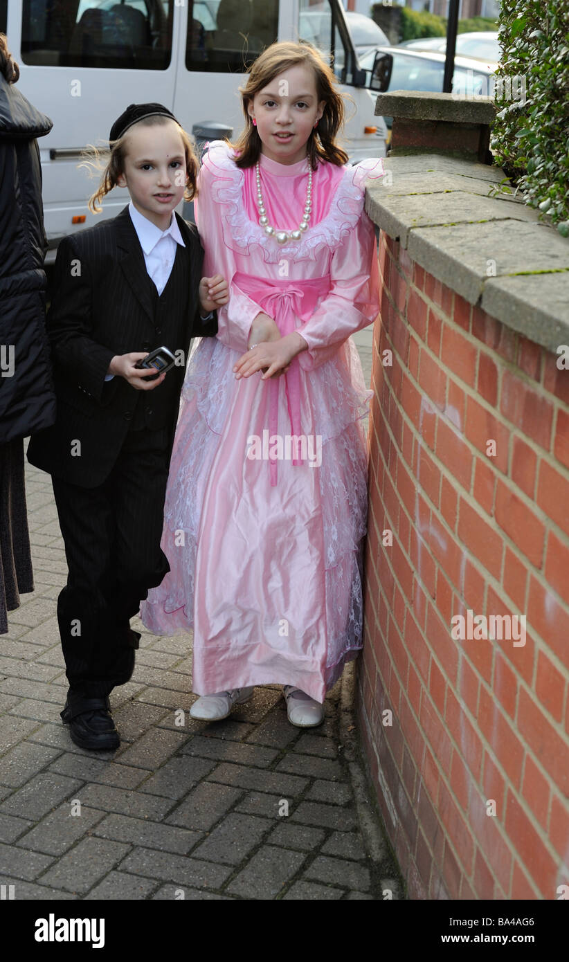 Two orthodox Jewish children dressed up for the festival of Purim on a ...