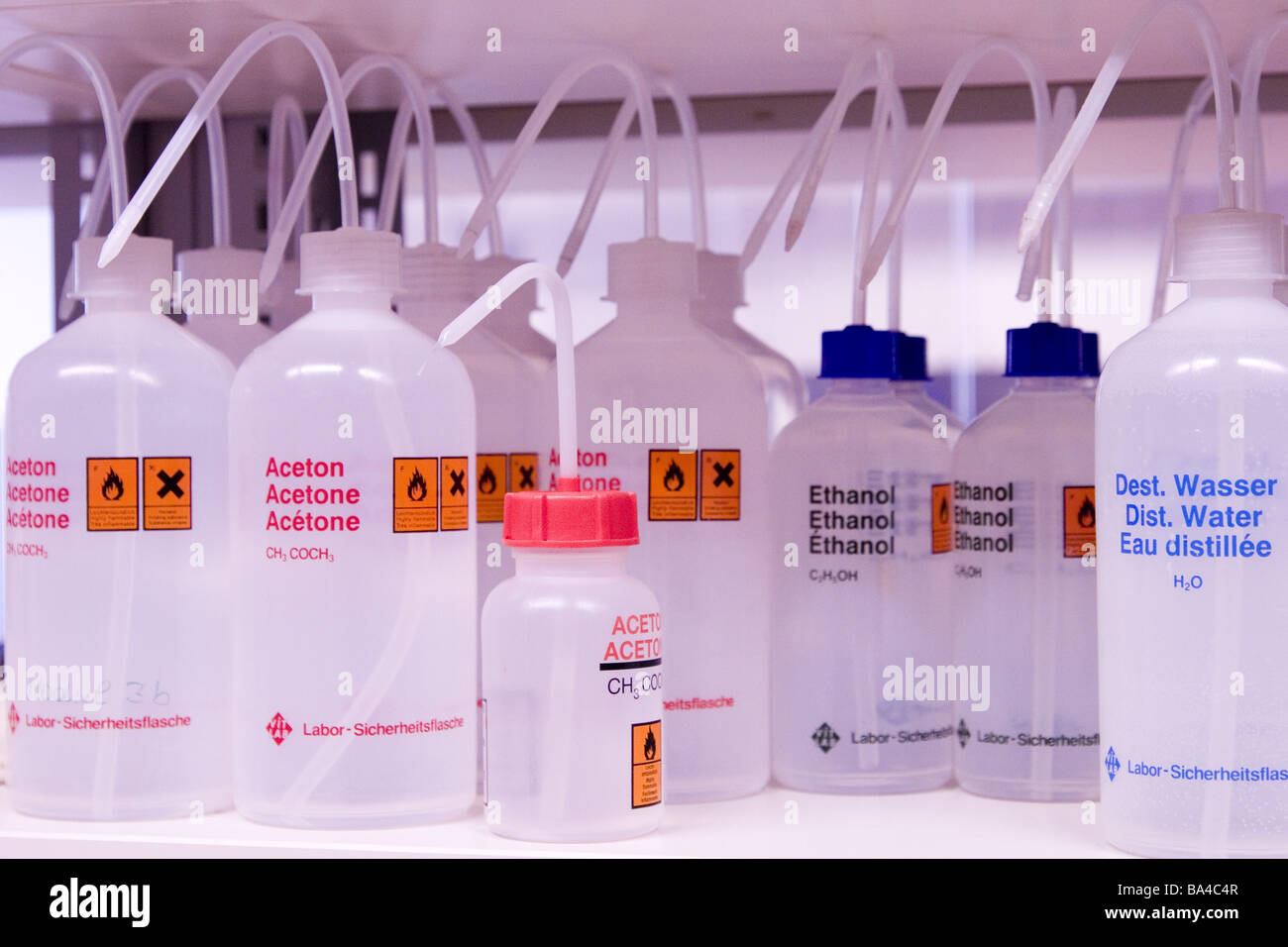 Laboratory shelf plastic-bottles detail labelings differently ...