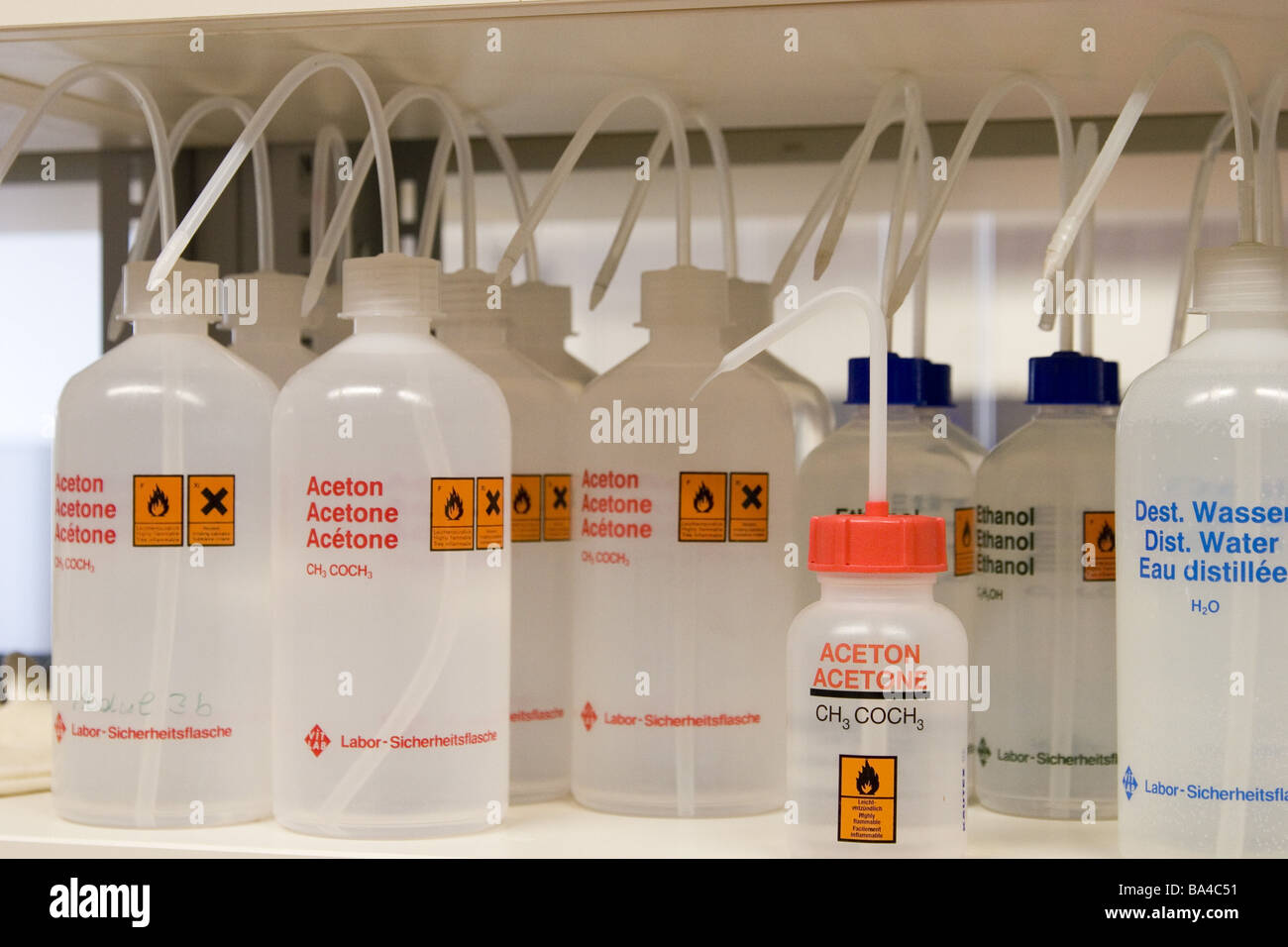 Laboratory shelf plastic-bottles detail labelings differently ...
