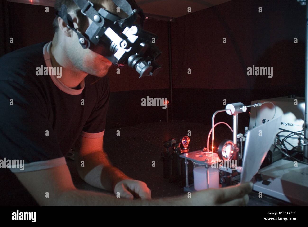 Researchers monitor magnifying glass test detail no models release man ...