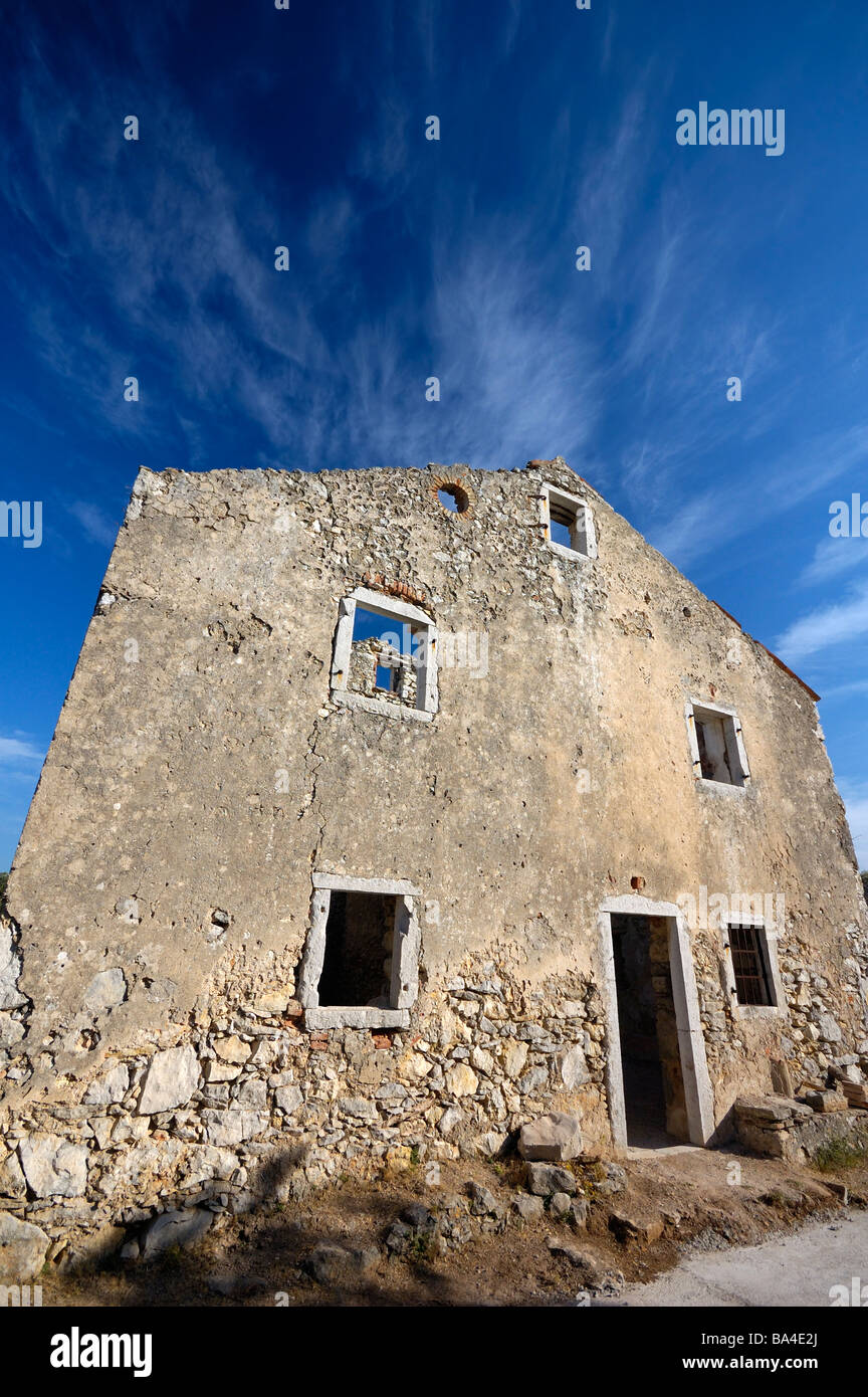 Ruin of traditional stone wall house, with no roof, windows and door on ...