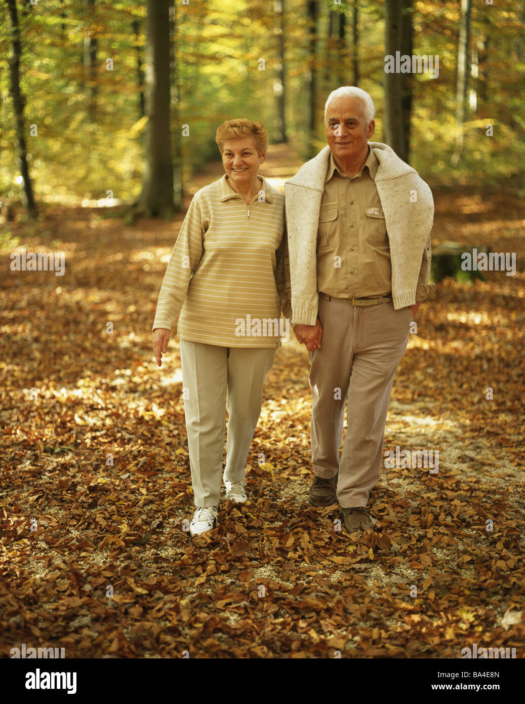 Forest senior-pair walk autumn series people pair seniors 60-70 years ...