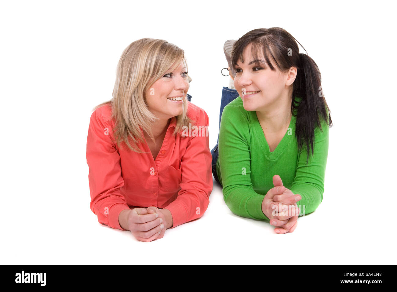 two crazy women in friendship over white background Stock Photo - Alamy