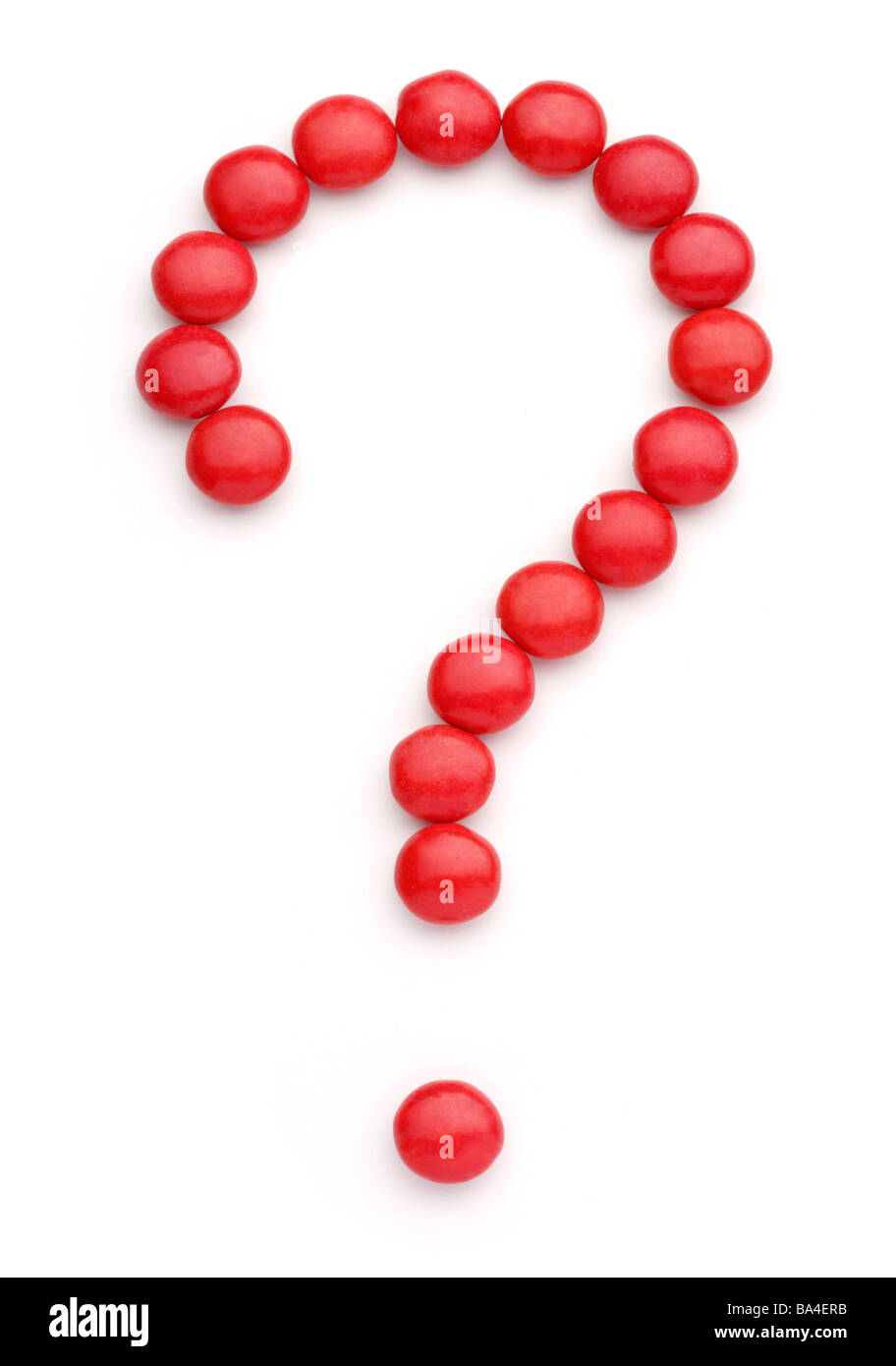 Candy laid out to make sign of question mark Stock Photo - Alamy