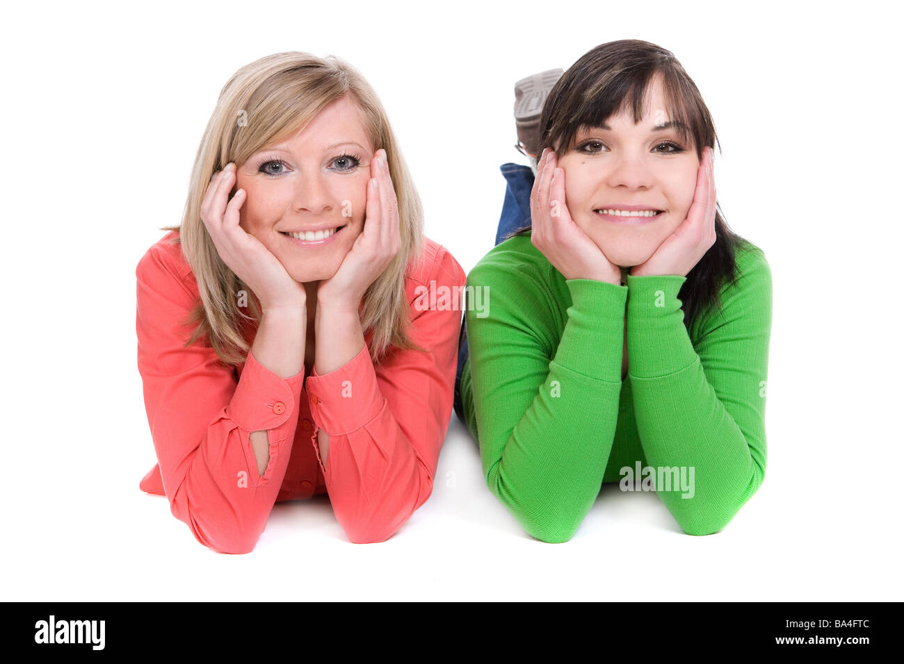 two crazy women in friendship over white background Stock Photo - Alamy