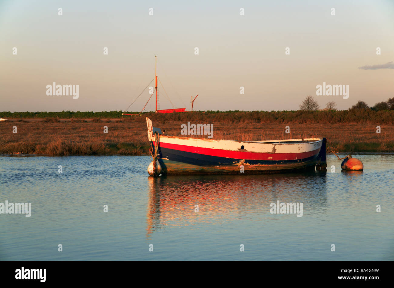 A traditional clinker built boat moored in Blakeney harbour, Norfolk ...