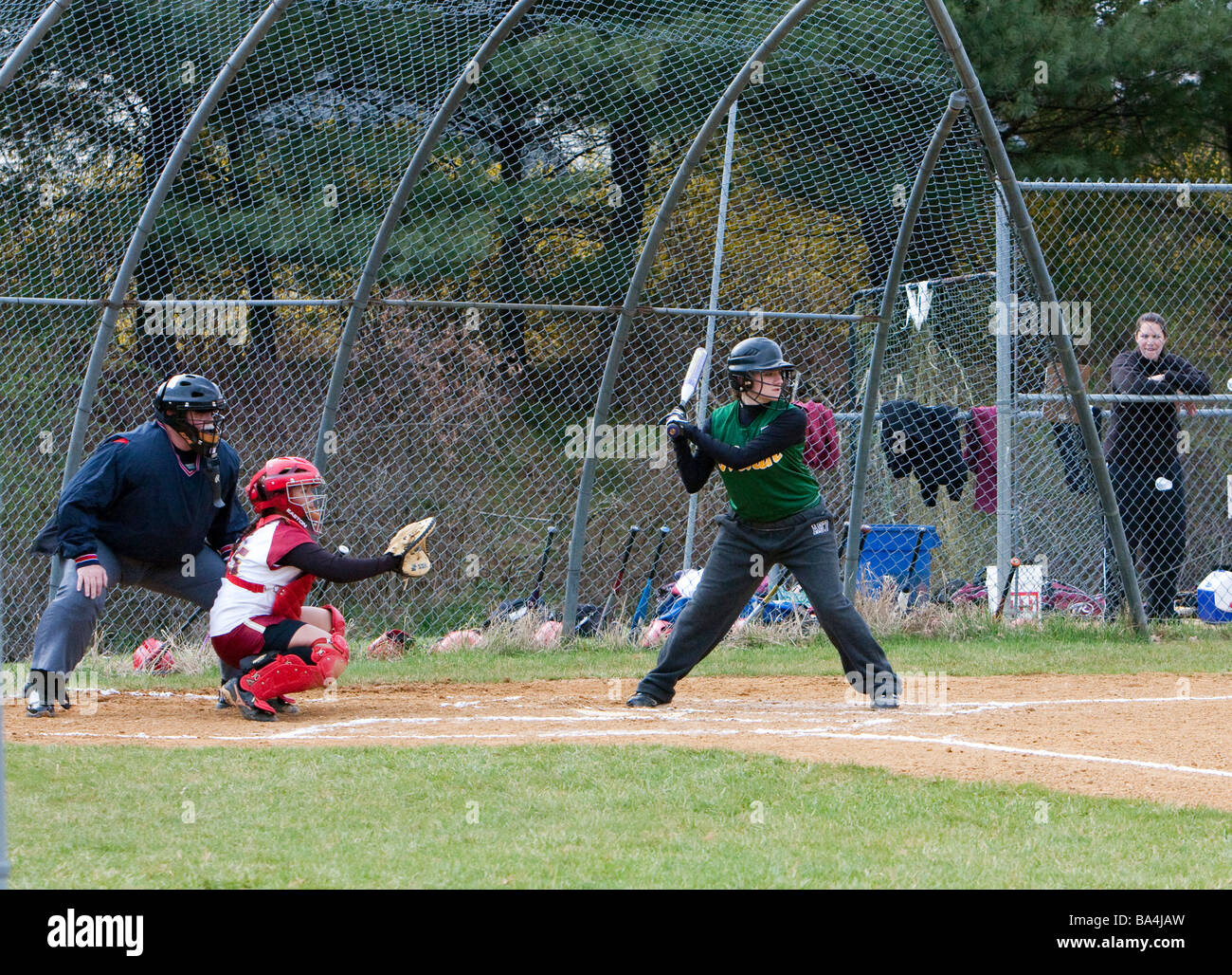 A batter, catcher and umpire at a girls highschool softball game Stock ...