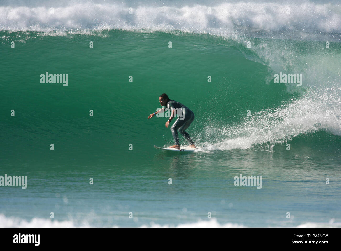 A Surfer surfing on a wave Stock Photo - Alamy