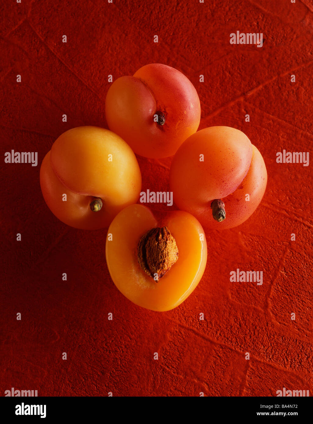 Orange apricot in half hi-res stock photography and images - Alamy