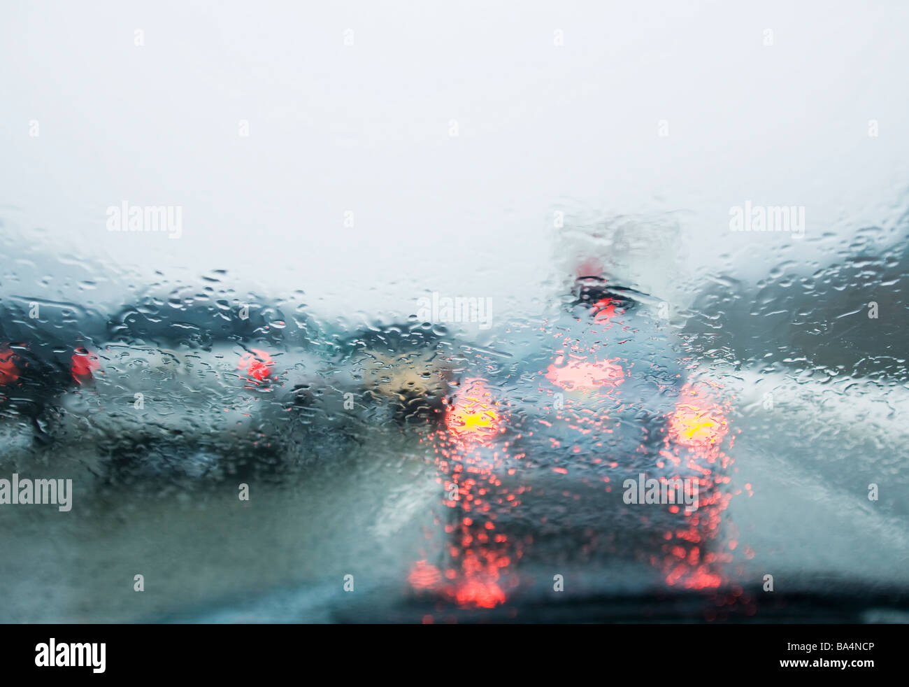 Water covered window looking out at bumper to bumper traffic Stock ...