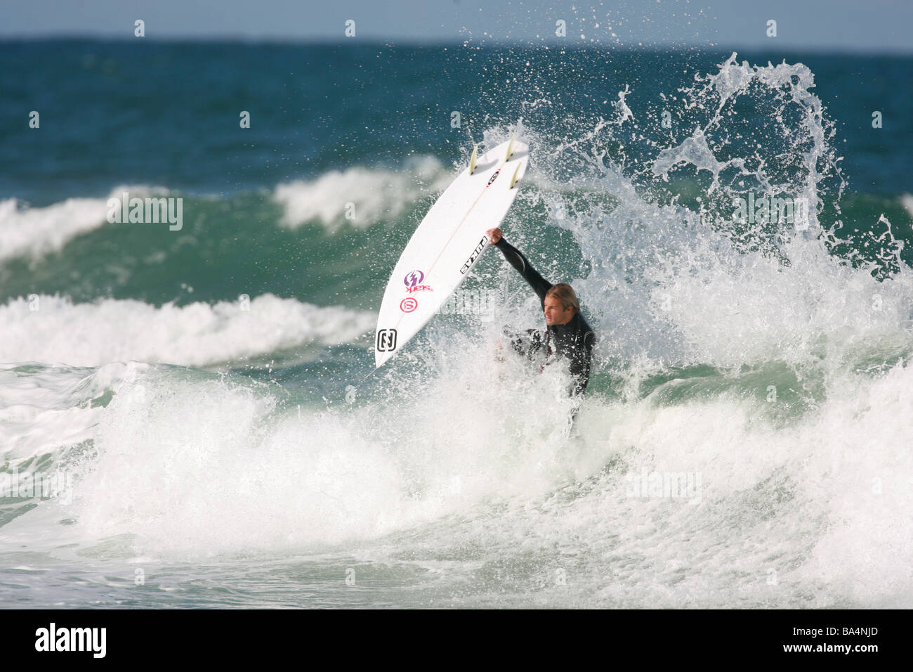 A Surfer wipes out on a wave Stock Photo - Alamy