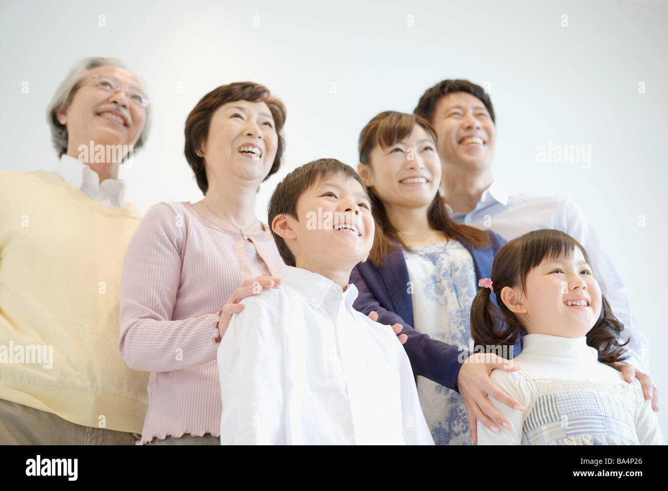 Asian family standing together hi-res stock photography and images - Alamy
