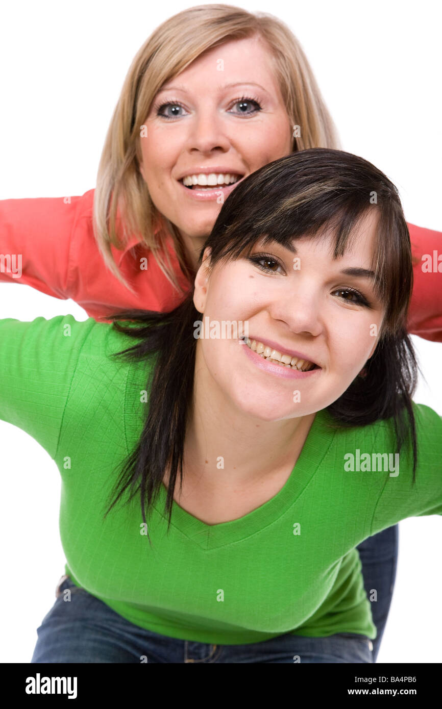 two crazy women in friendship over white background Stock Photo - Alamy