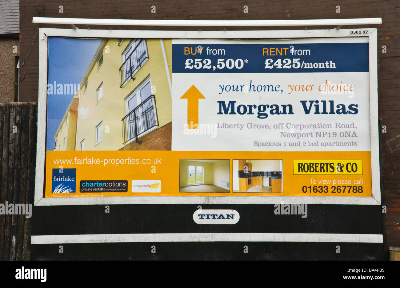 Titan billboard site advertising local house sales on hoarding in ...