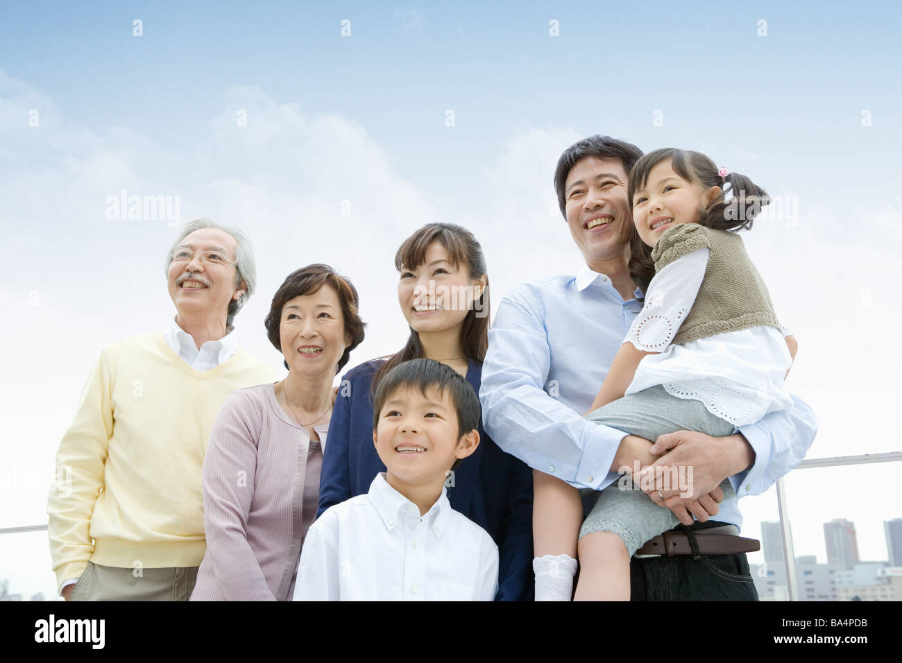 Asian family standing together Stock Photo - Alamy