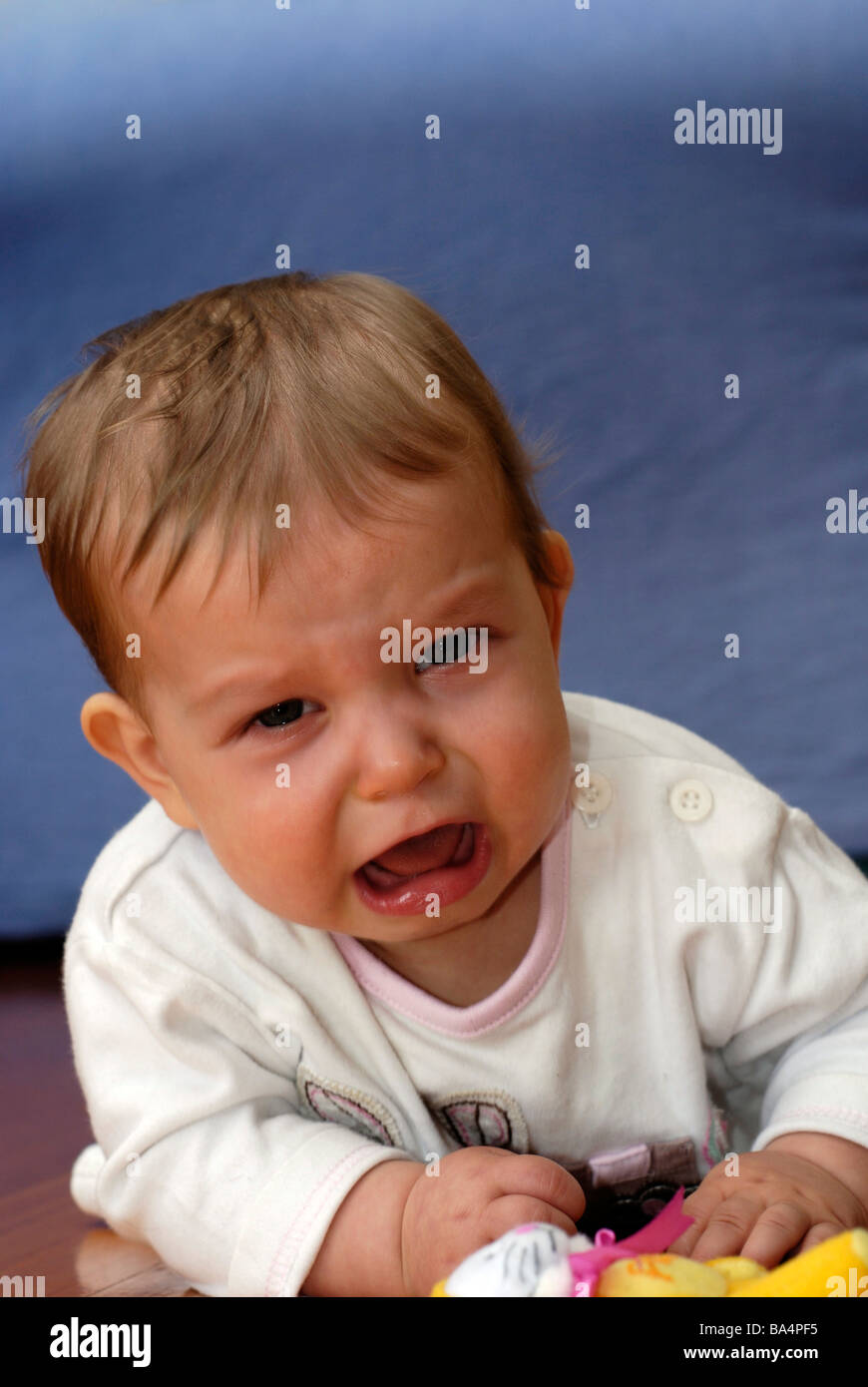 Eight month old baby crying Stock Photo - Alamy