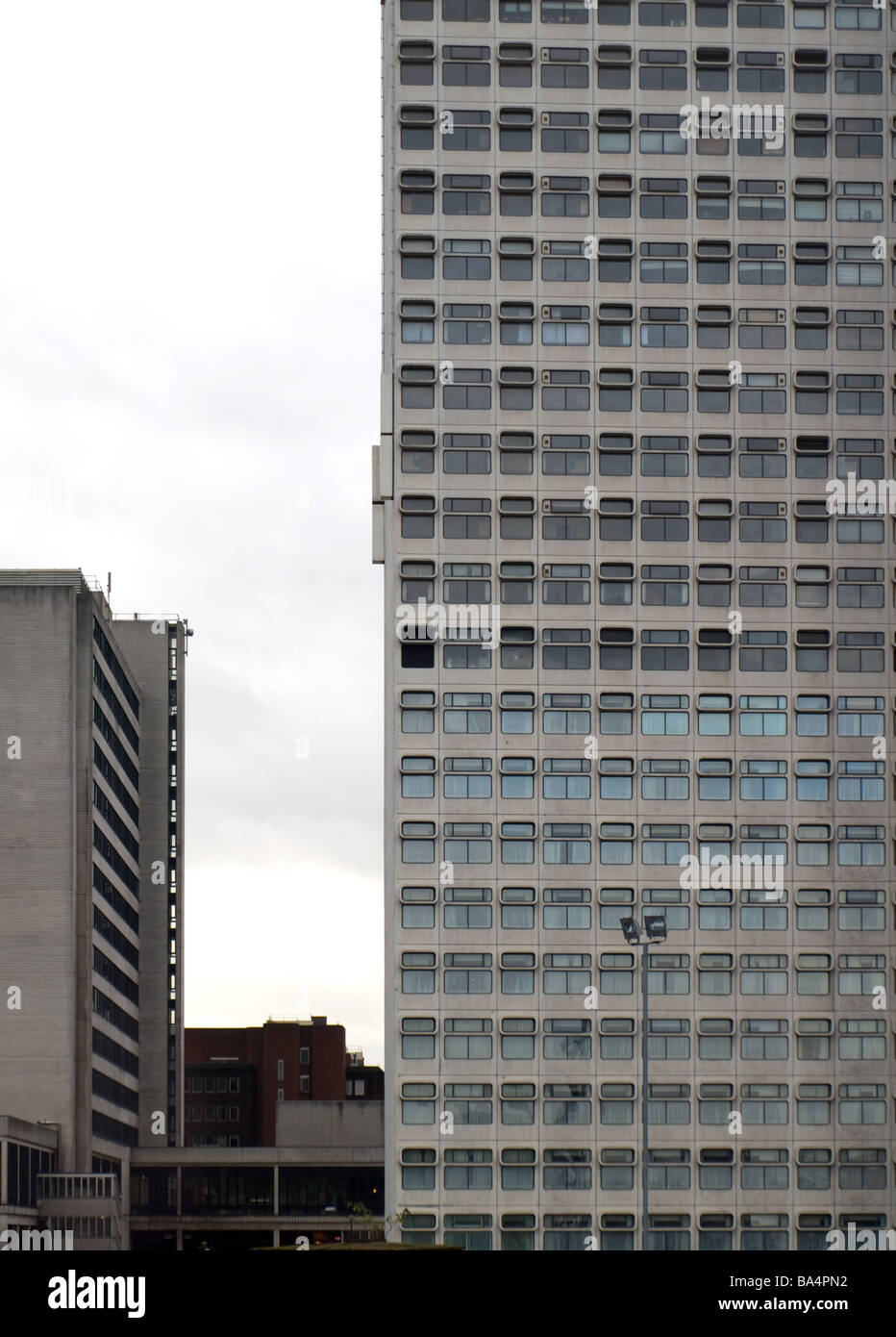 Tall High rise Building in Grey 70s Style Tower Stock Photo - Alamy