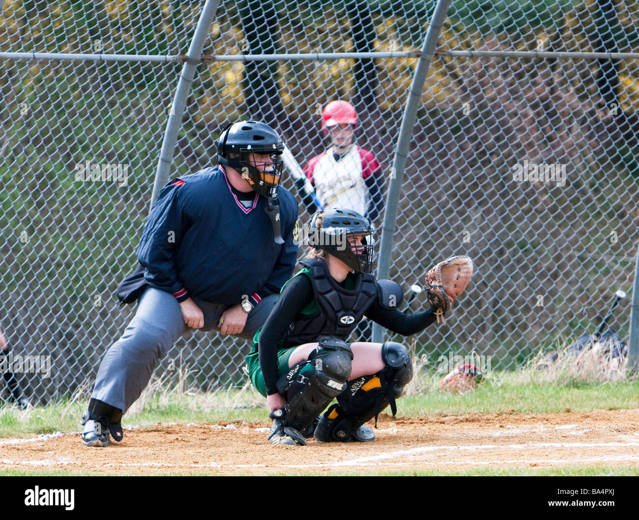 A batter, catcher and umpire at a girls highschool softball game Stock ...