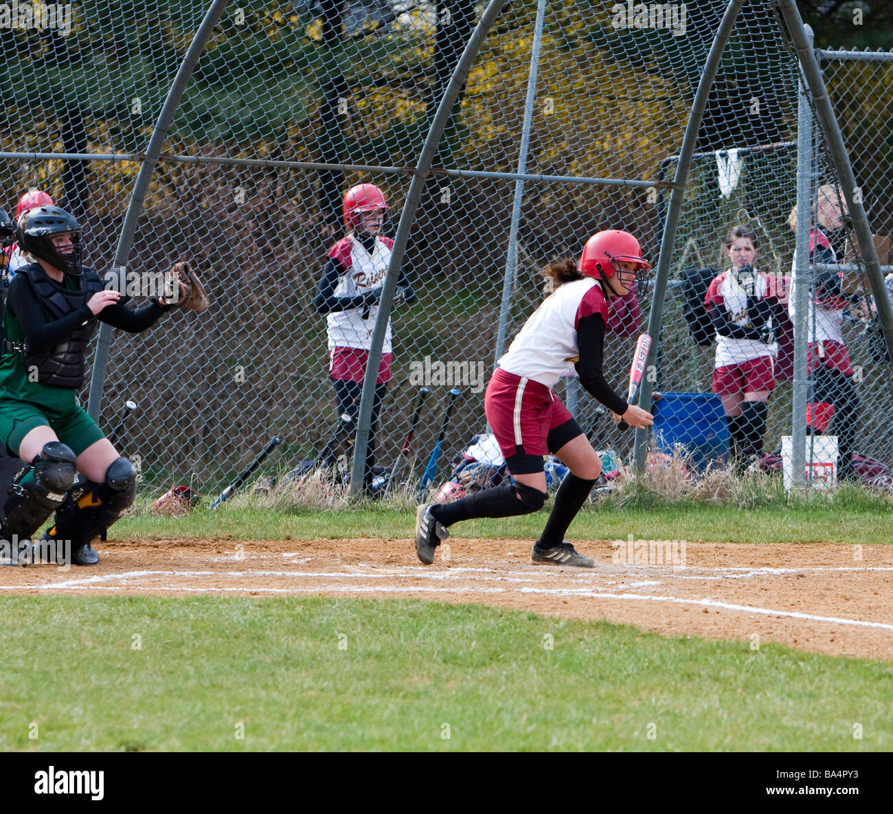 A batter, catcher and umpire at a girls high school softball game Stock ...