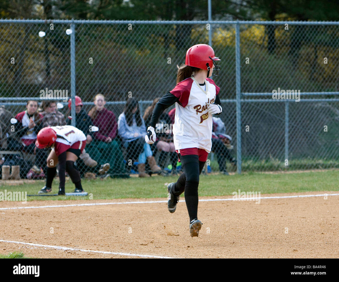 A girls high school softball game Stock Photo - Alamy