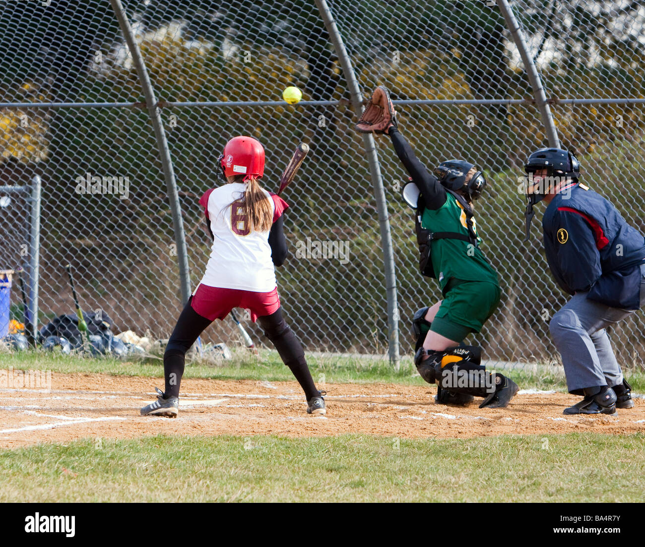 A batter, catcher and umpire at a girls highschool softball game Stock ...