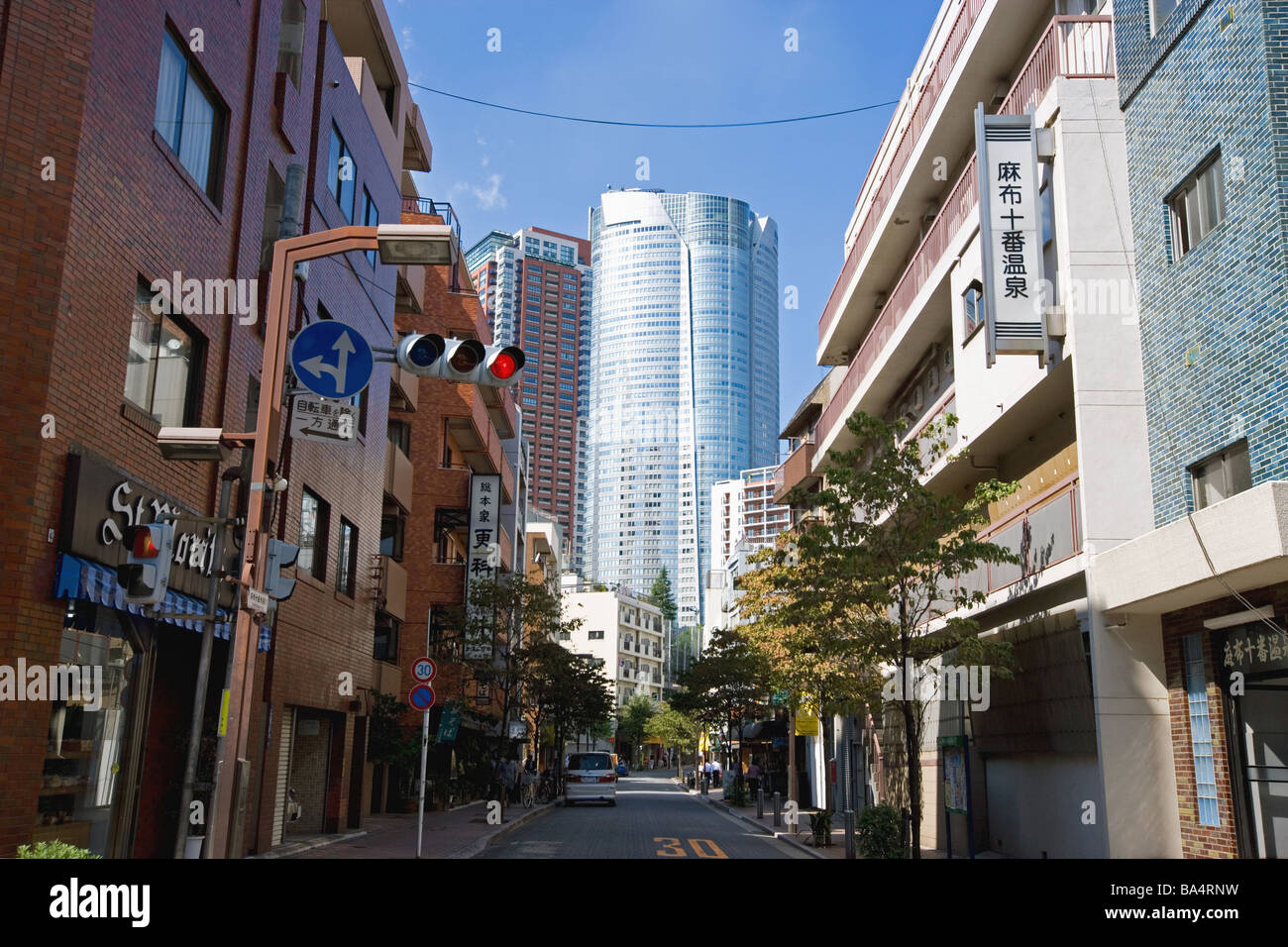 Red Light on Road with Mori Tower, Roppongi Hills, Tokyo, Japan Stock ...