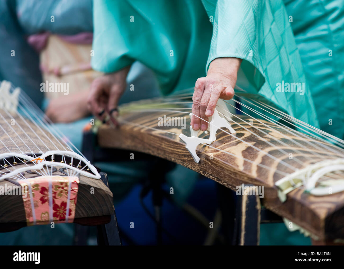Closeup of a Japanese woman tuning a Koto Stock Photo - Alamy