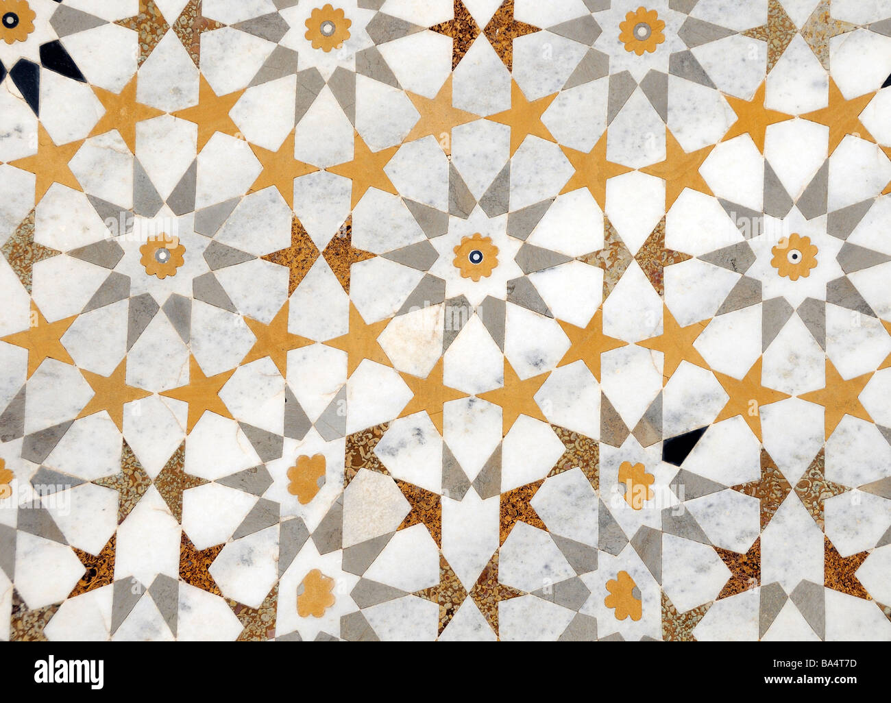 A floor made of a repeating pattern of regular shapes made from semi ...