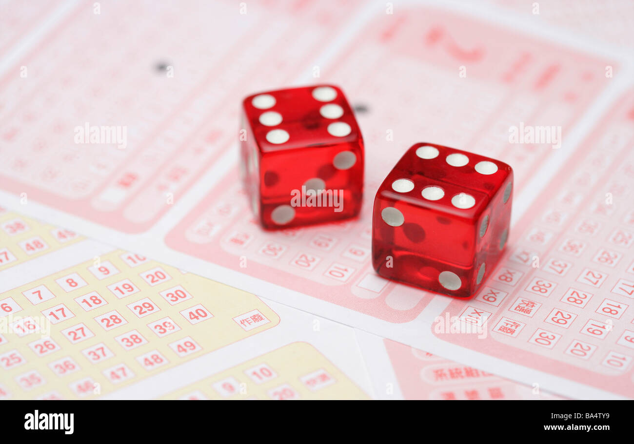 Dice on lottery ticket Stock Photo - Alamy