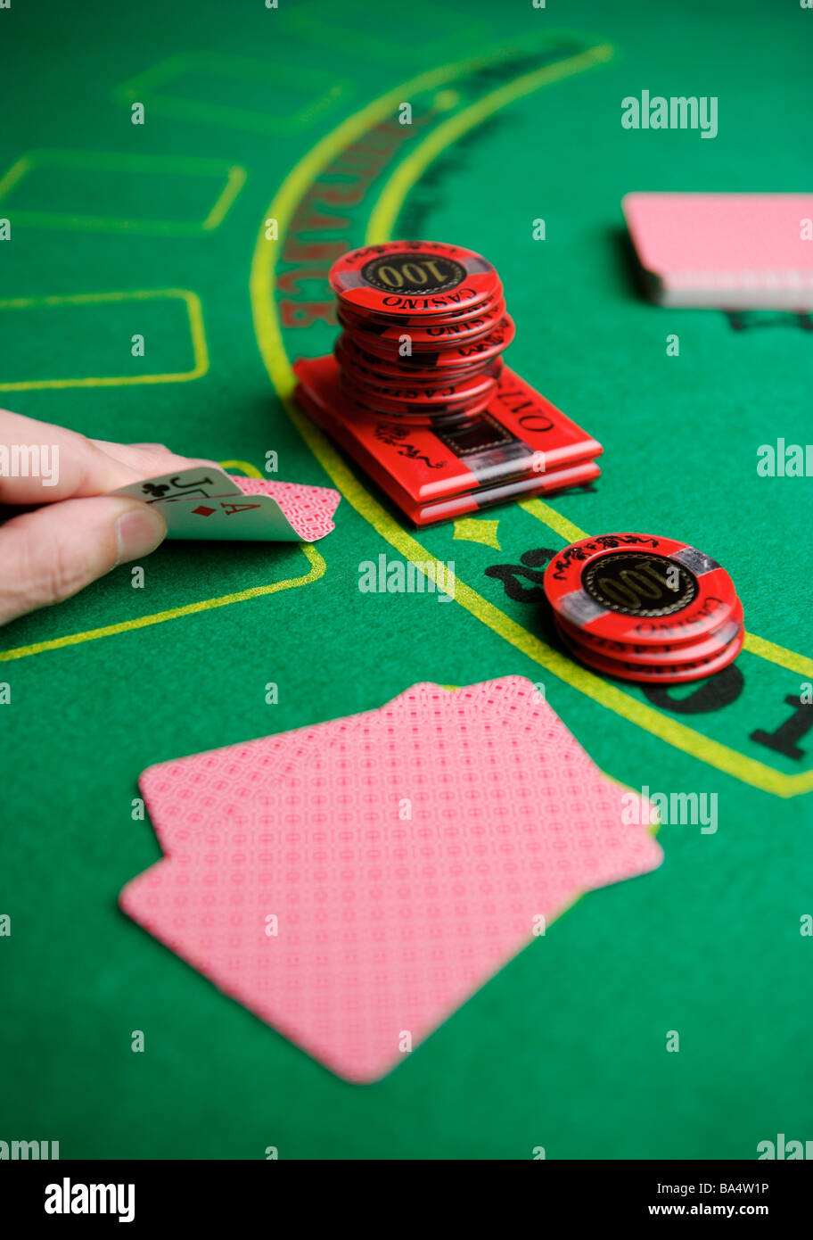 Man playing poker looking at cards close up rear view Stock Photo - Alamy