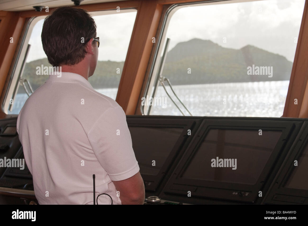 Captain on watch on the bridge aboard superyacht "Big Aron" keeping ...