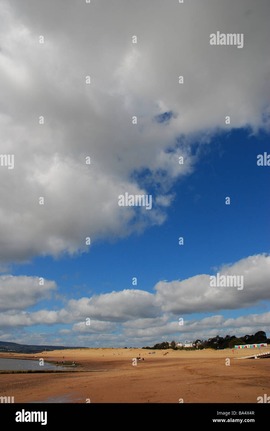 Looking at Exmouth beach with a dramatic sky with sand dunes in the ...