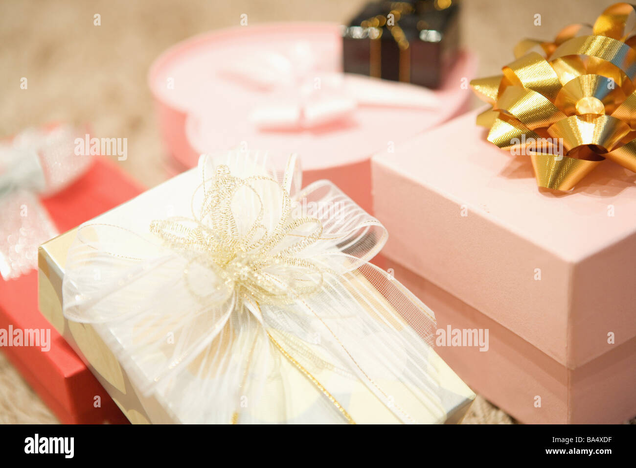 Wrapped present with an ornate bow Stock Photo - Alamy