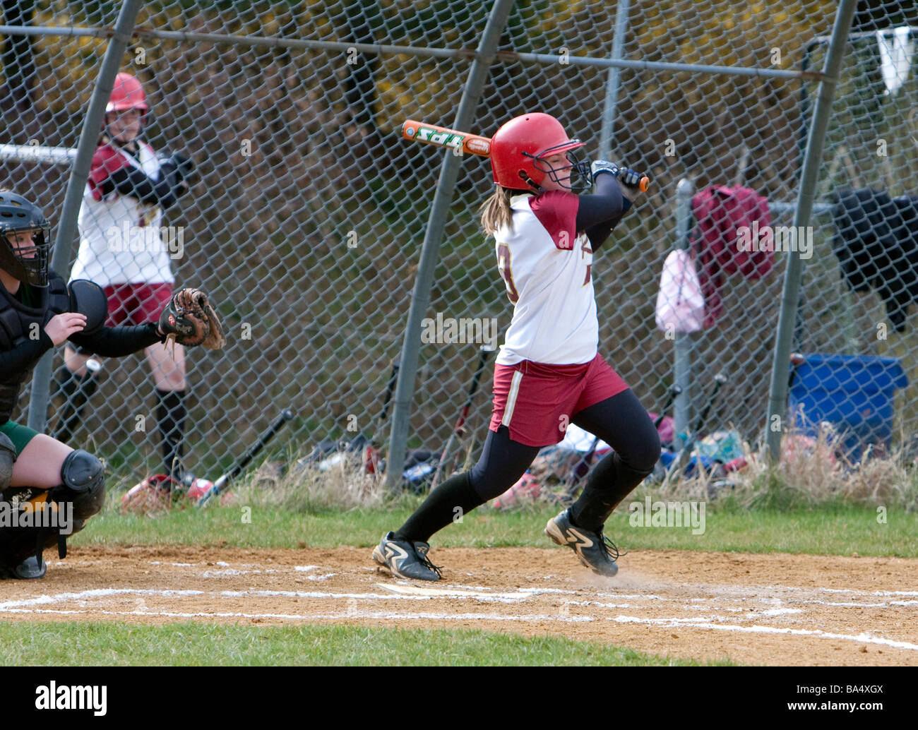 A batter, catcher and umpire at a girls highschool softball game Stock ...