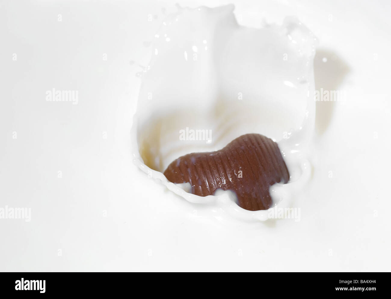 Falling sweet chocolate in milk hi-res stock photography and images - Alamy