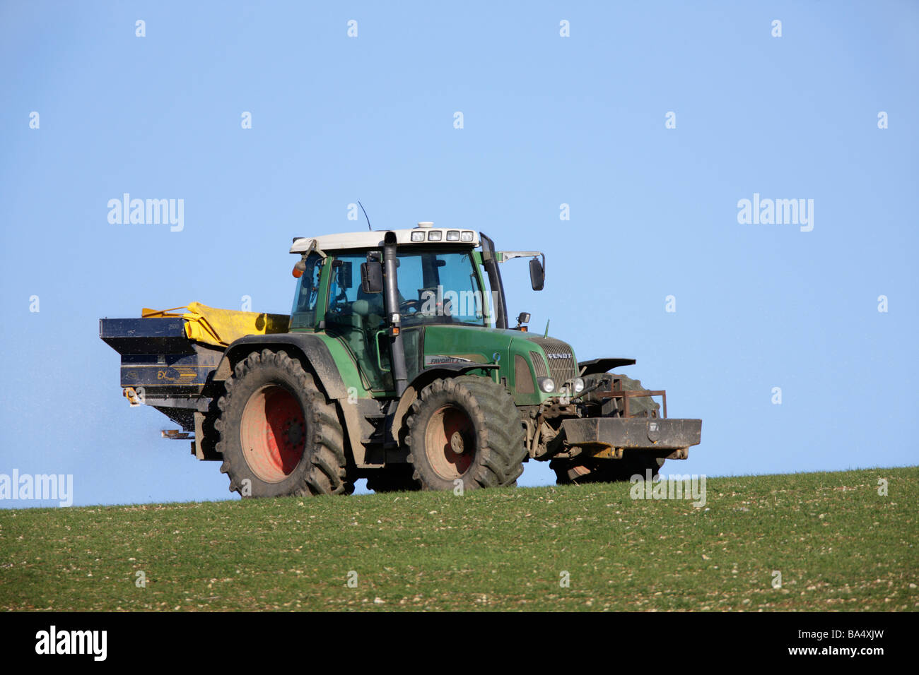 Tractor spreading fertilizer Stock Photo - Alamy
