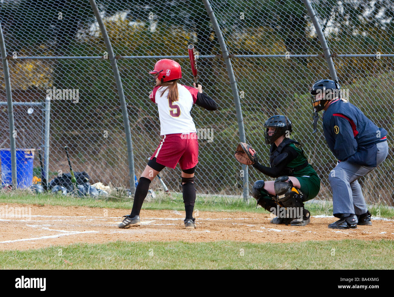 A batter, catcher and umpire at a girls highschool softball game Stock ...