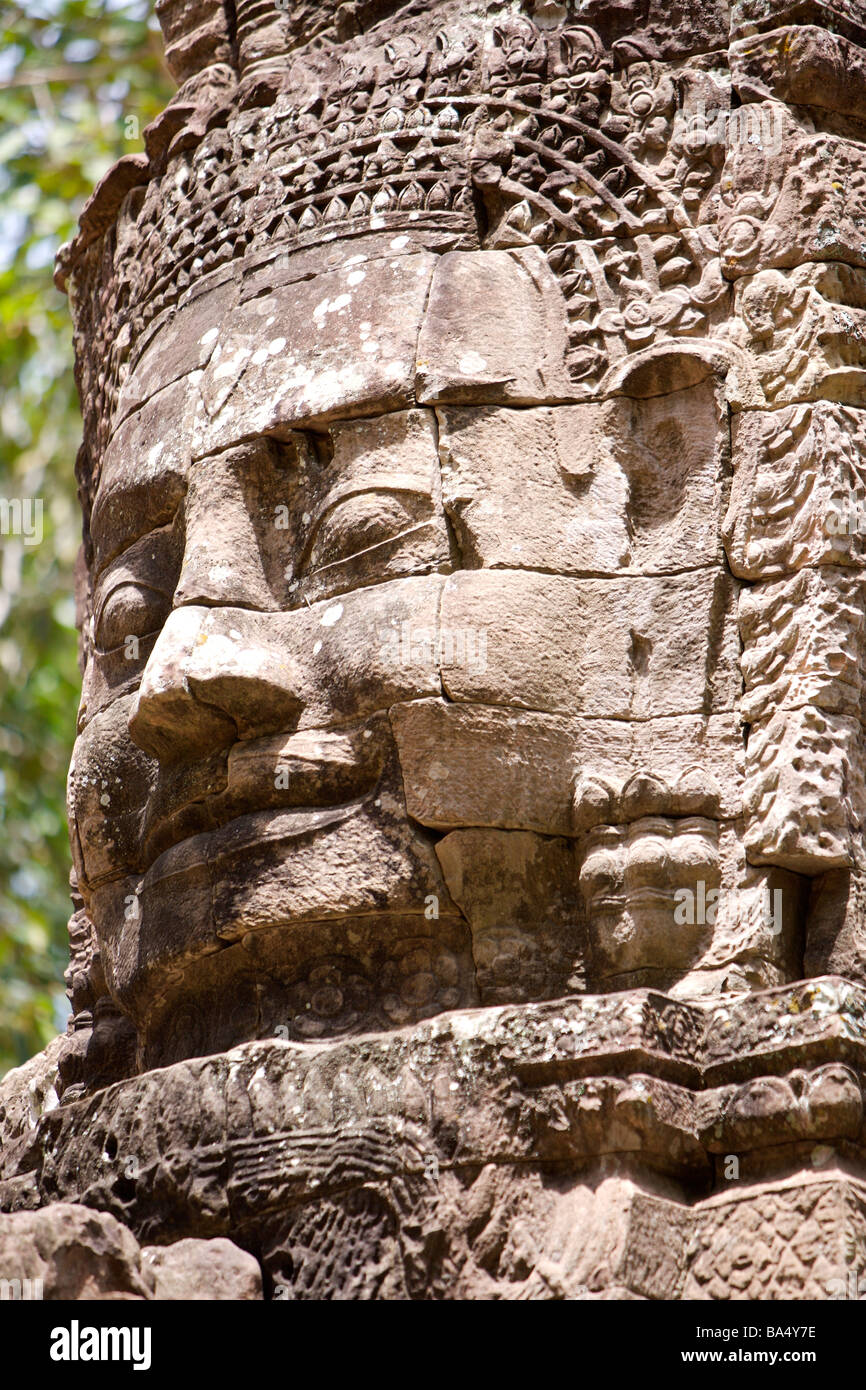 The smiling stone face of Avalokiteshvara in the Bayon temple Stock ...