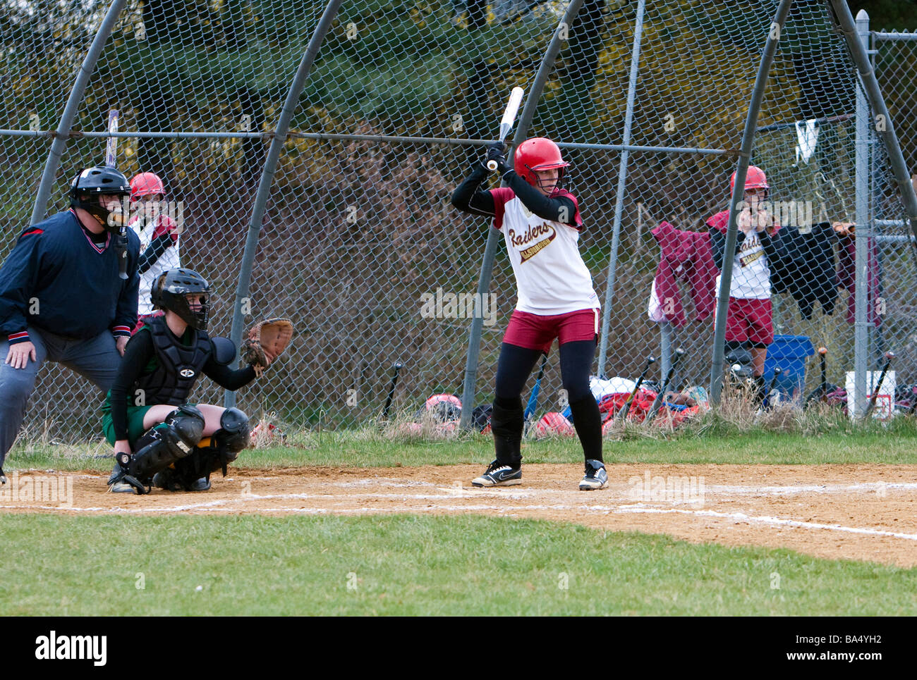 A batter, catcher and umpire at a girls highschool softball game Stock ...