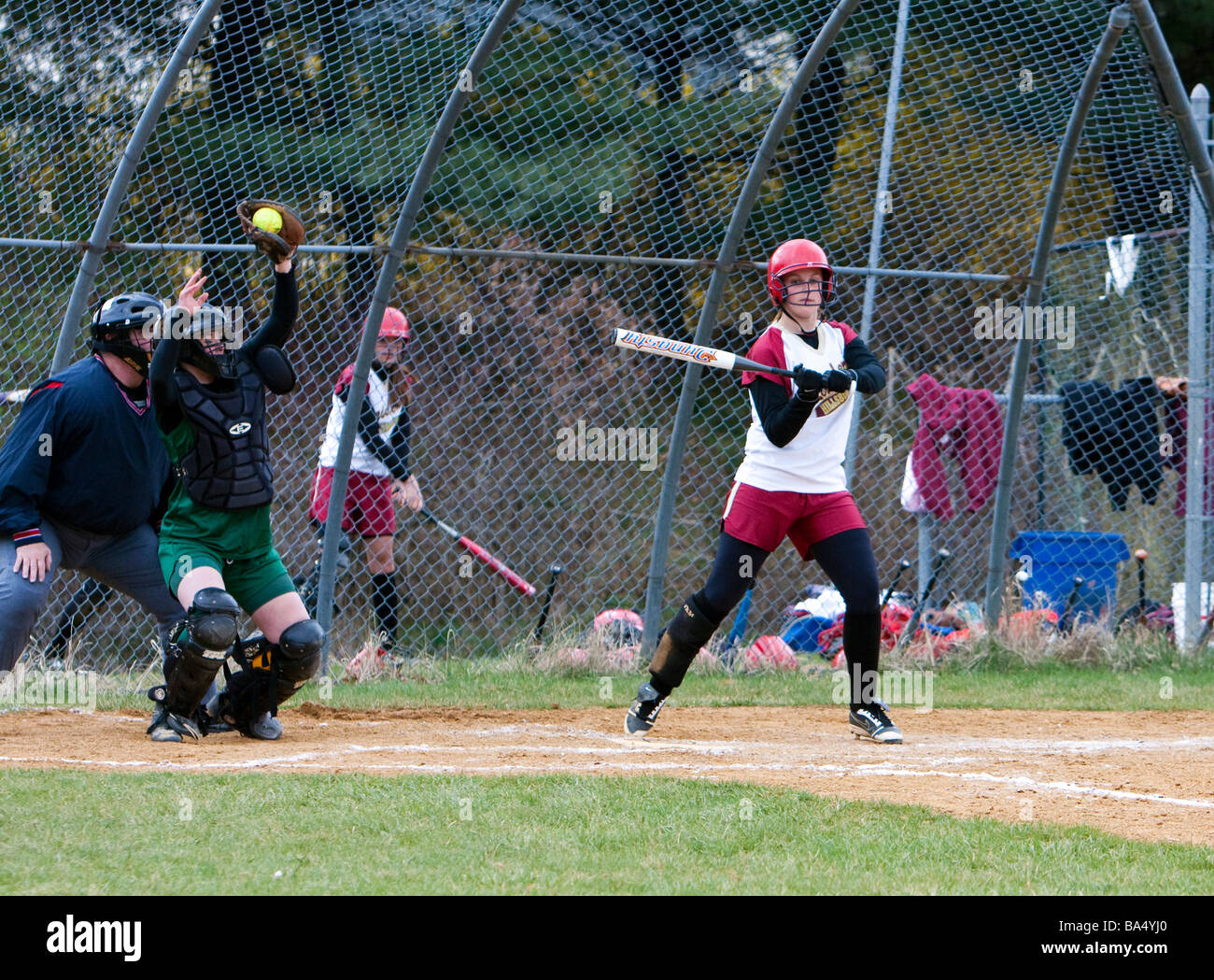 A batter, catcher and umpire at a girls highschool softball game Stock ...