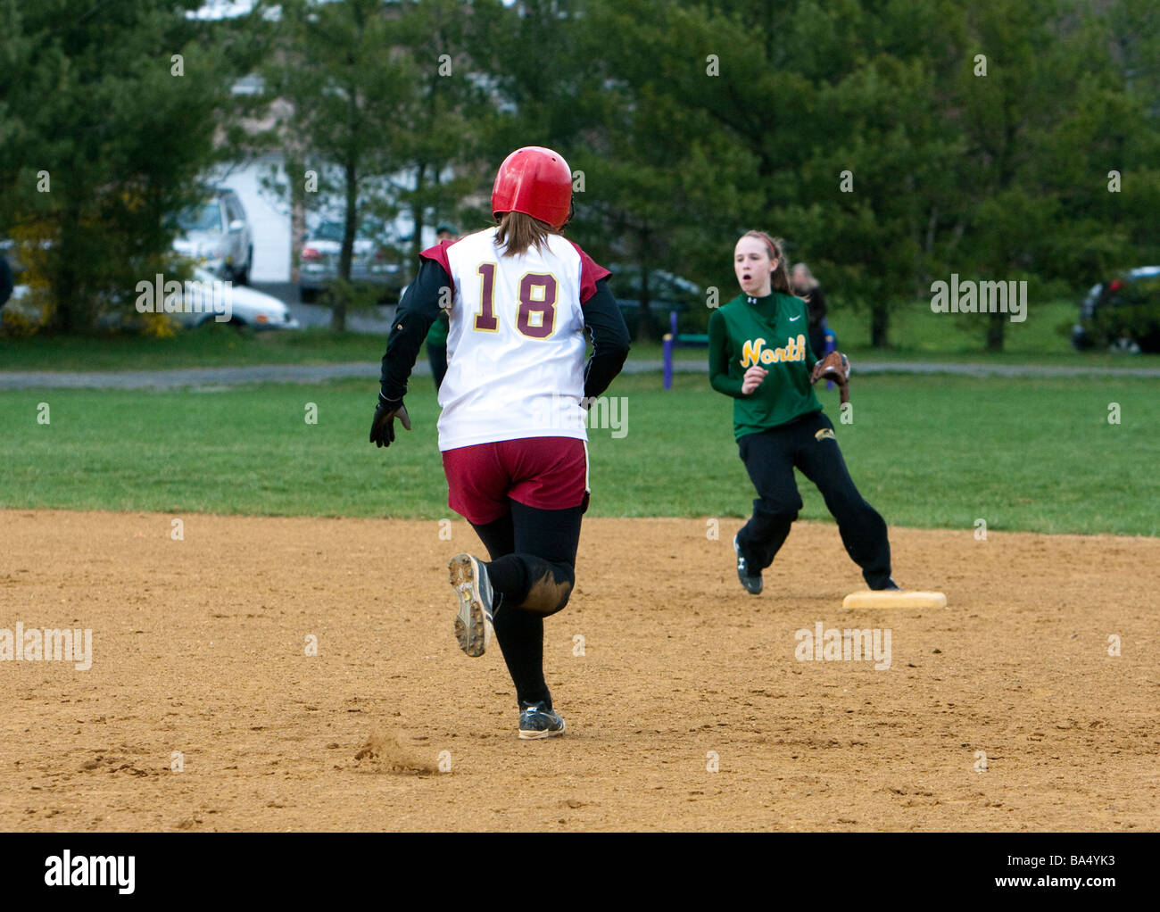 A girls high school softball game Stock Photo - Alamy