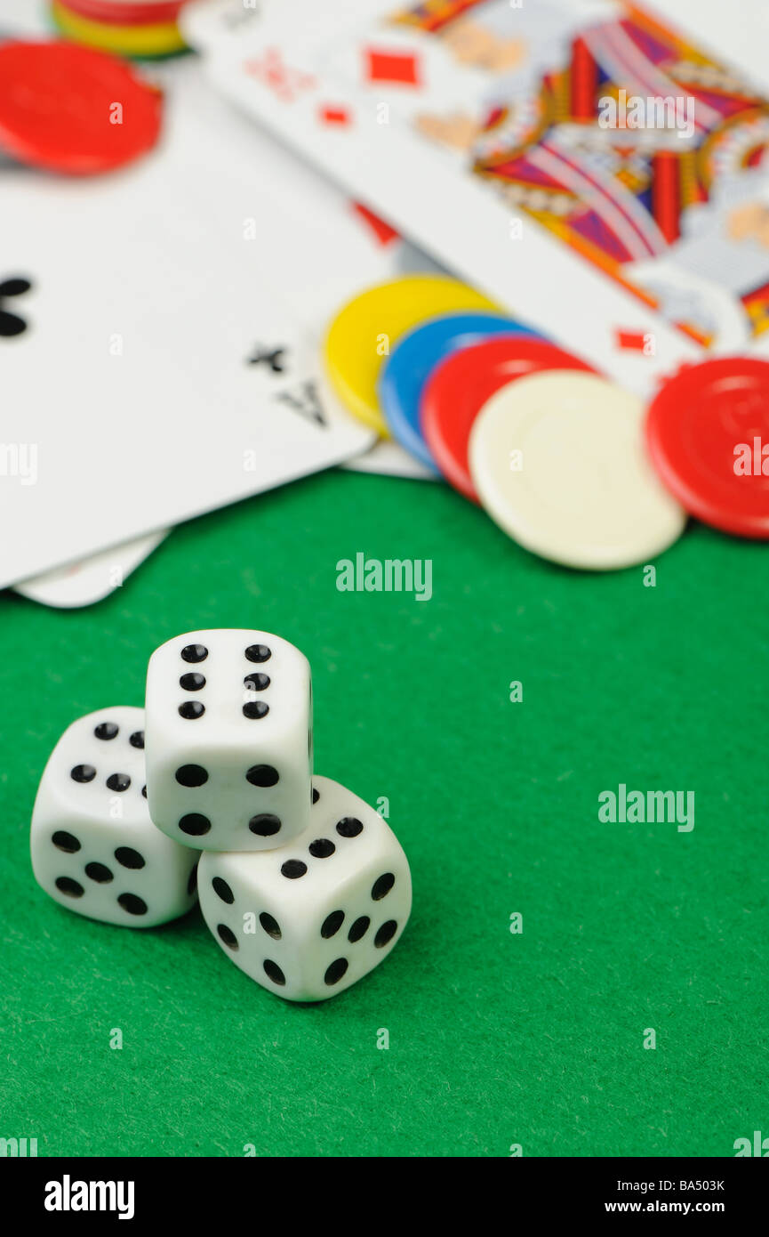 dices and playing cards Game cubes and Playing cards on a green ...