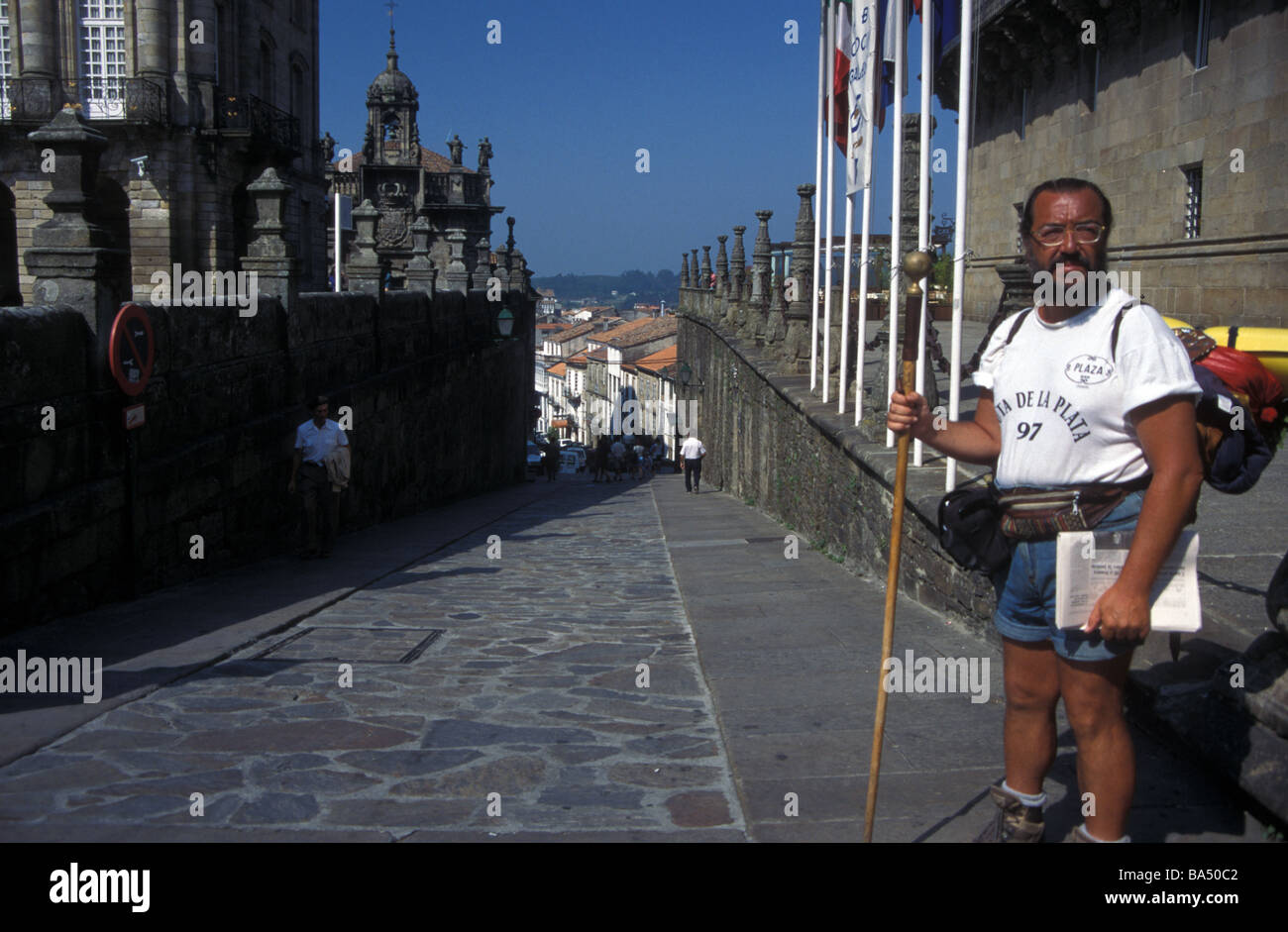 catholic Christian Spanish pilgrim walk hiker arriving at Santiago del ...