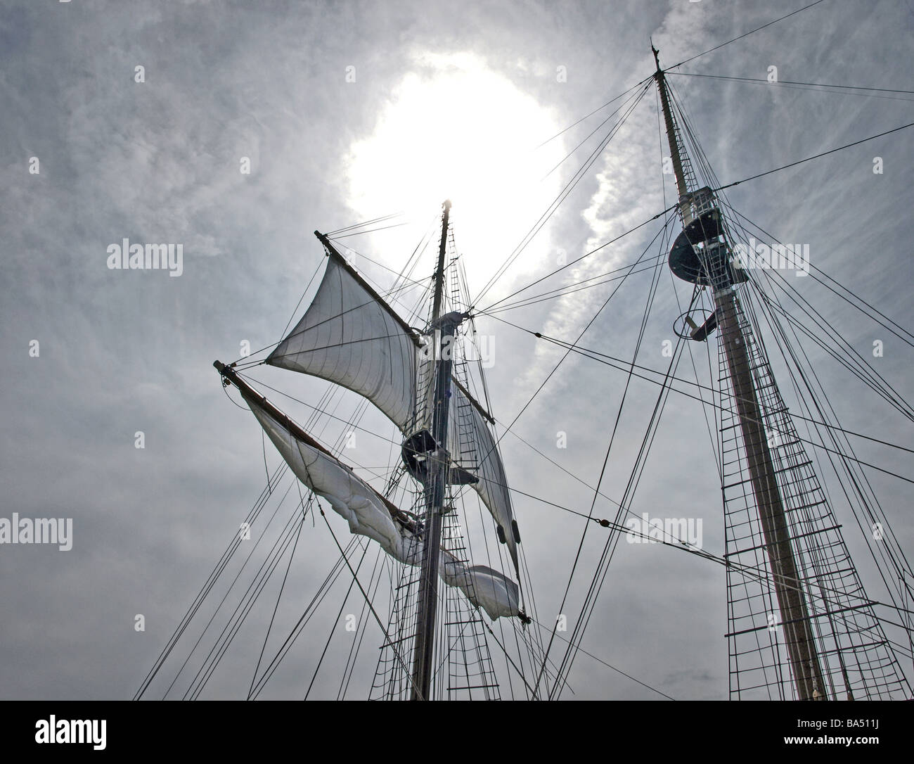 tall-ship tall-ships two of three masts looking upward with bright sun ...