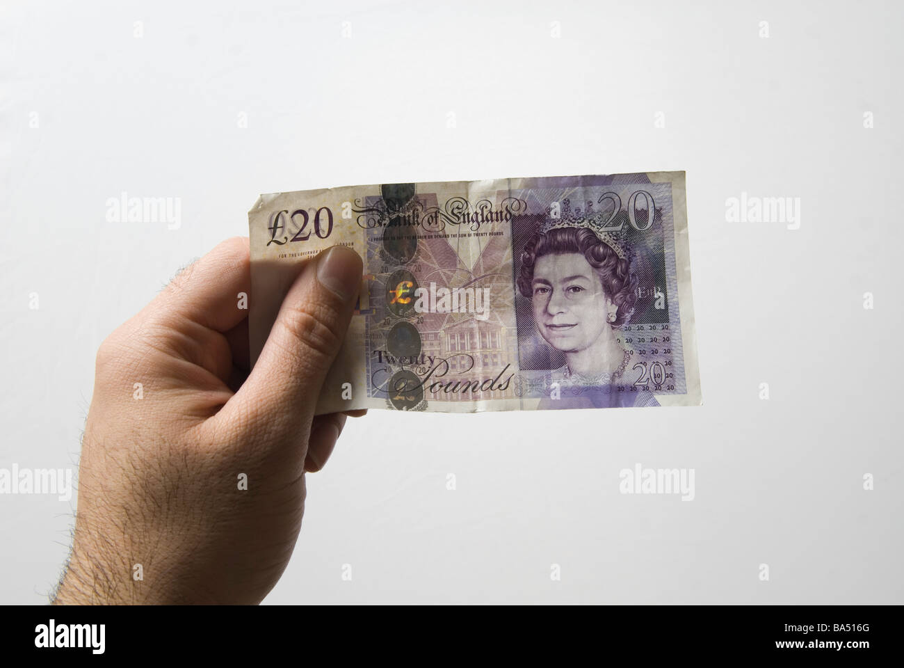 Hand holding british banknotes hi-res stock photography and images - Alamy