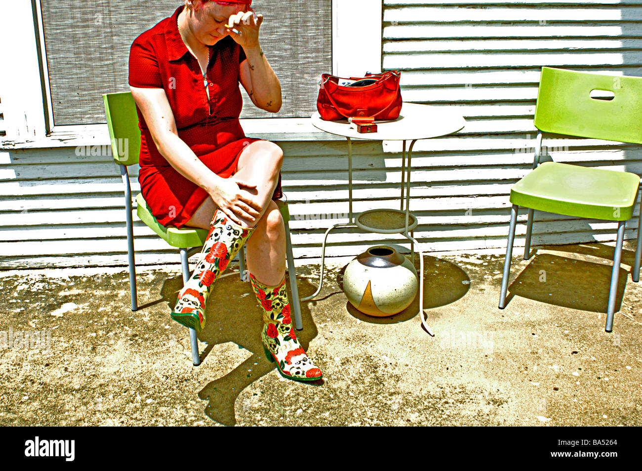 Middle class lady in bright red dress sitting on victorian ...